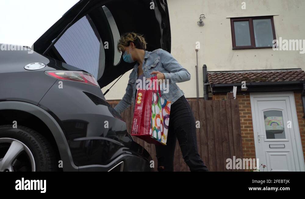 Woman loading car side Stock Videos & Footage - HD and 4K Video Clips ...