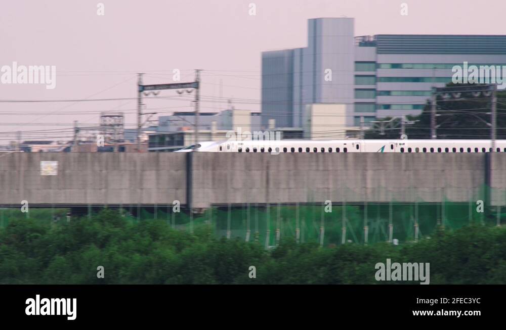 Shinkansen Bullet Train Travelling Across Tamagawa River Bridge Through ...