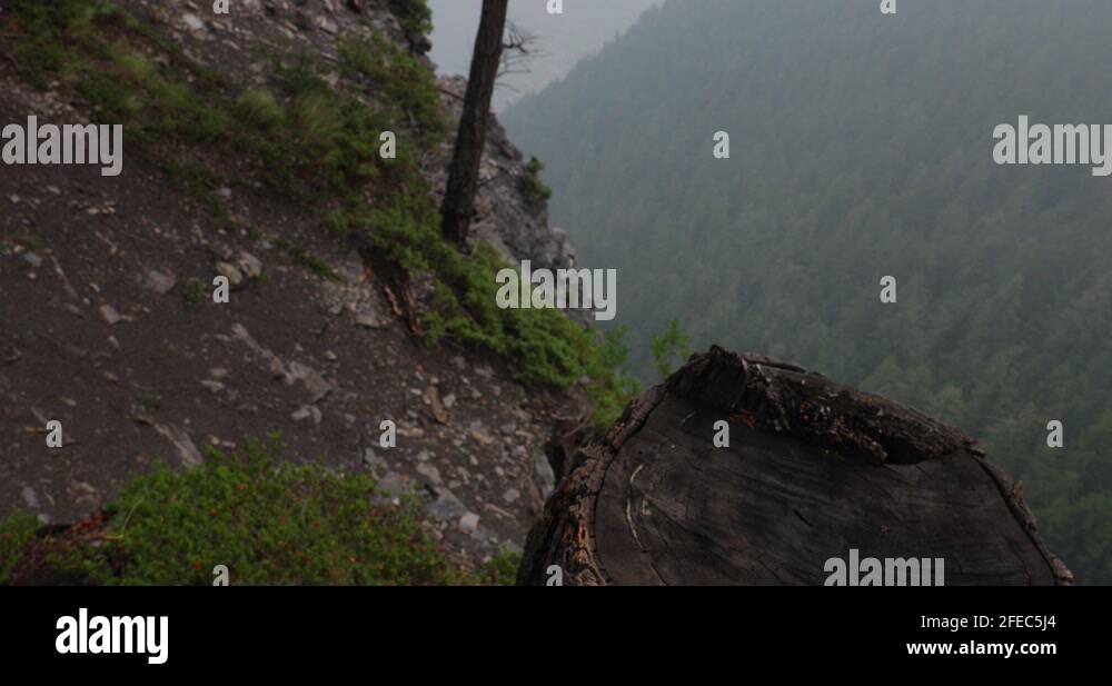 peering off a cliff into the smokey haze created by forest fires Stock ...