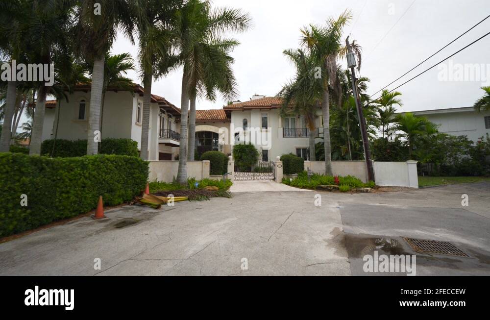 Arriving home to a luxury mansion with security gate 4k 60p Stock Video ...