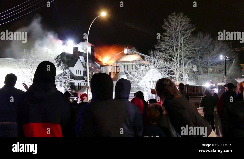 Crowd watching massive structure fire Stock Video Footage - Alamy