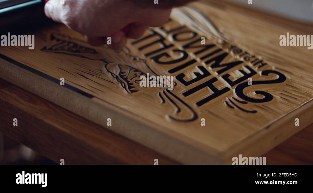 Rolling ink onto linoleum block for printmaking Stock Video Footage - Alamy