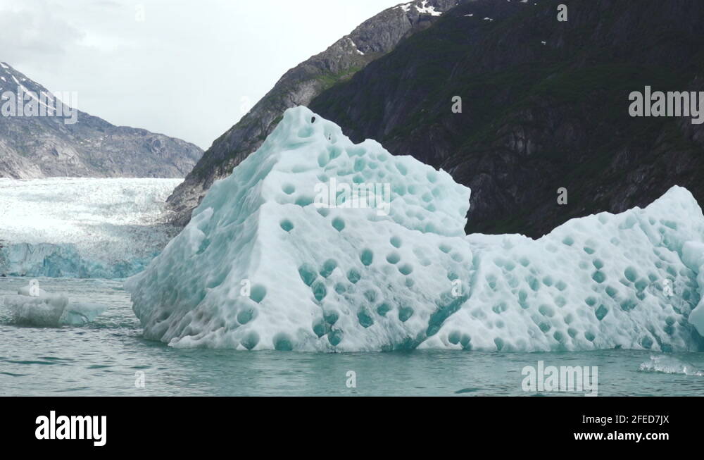Rugged Iceberg with Melted Holes in front of Dawes Glacier in Tracy Arm ...