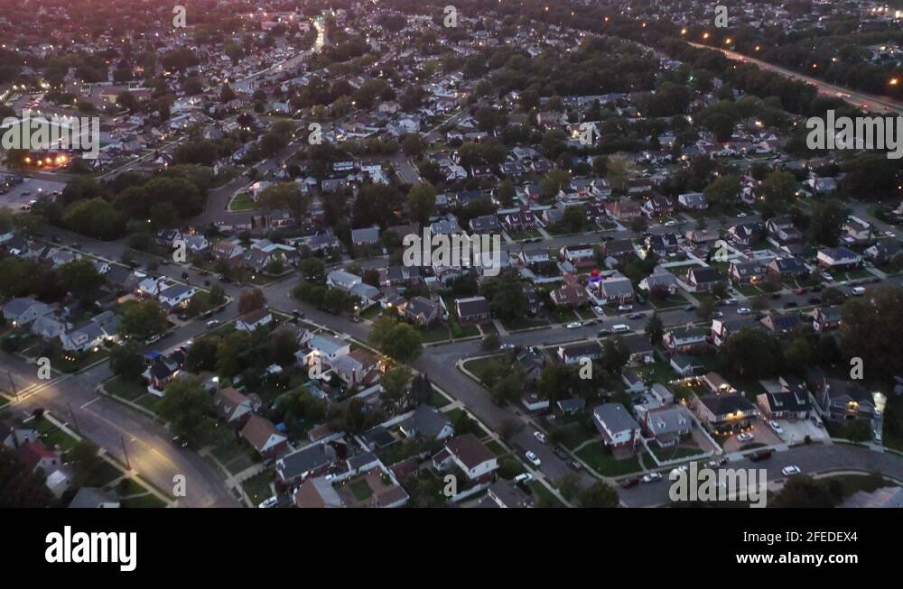 A bird's eye view taken over a quiet suburban neighborhood on Long ...