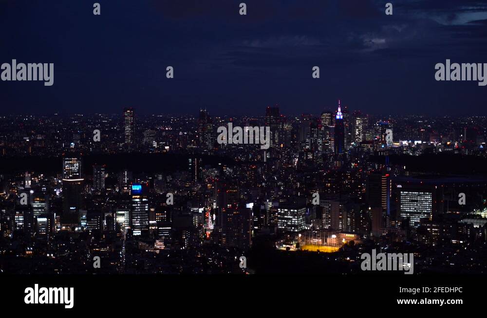 High above panoramic view out on Shinjuku, Tokyo skyline at night in 4k ...