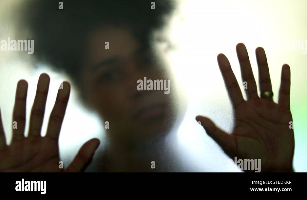 Woman feeling trapped behind glass, depression mental illness concept ...