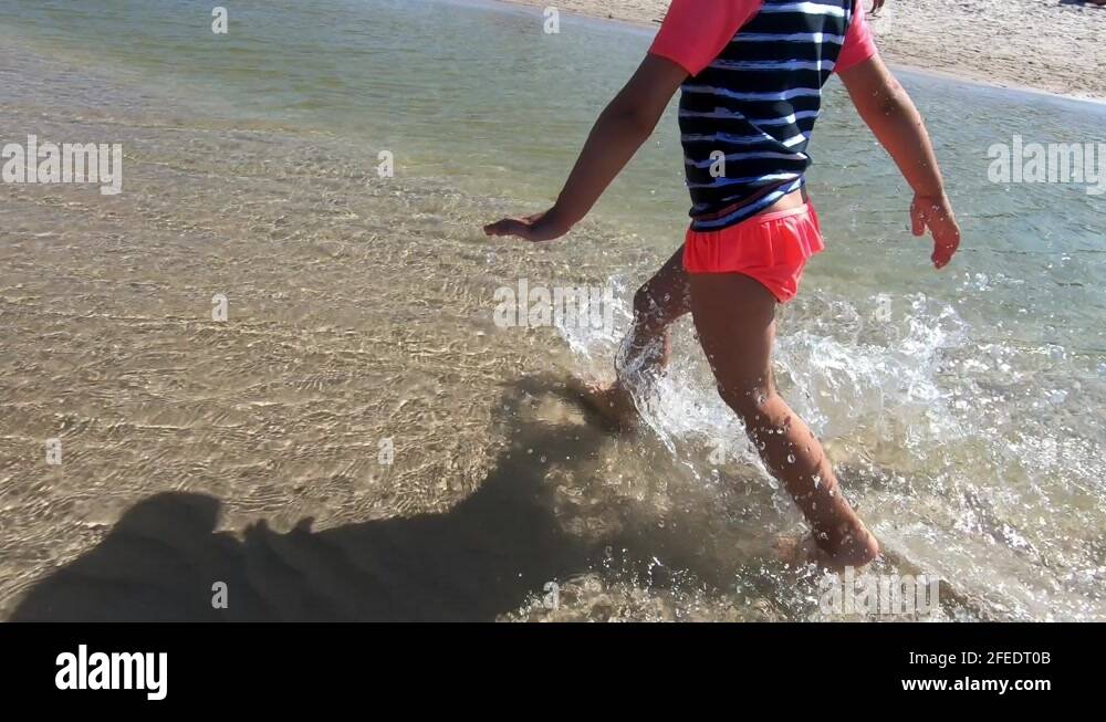 Girl walking in shallow water Stock Videos & Footage - HD and 4K Video ...