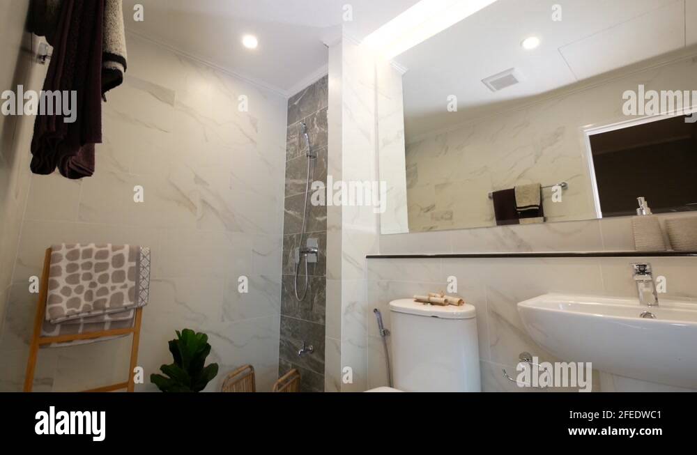 Clean and Tidy Toilet Dcorated With Marble Wall Stock Video Footage - Alamy
