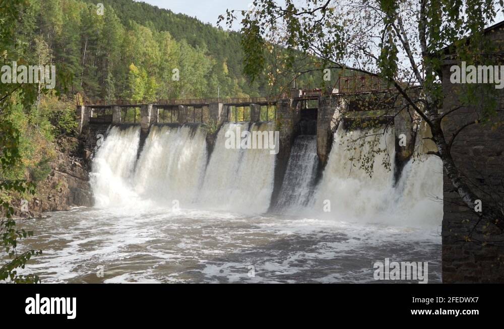 Water falls from a high dam Stock Video Footage - Alamy