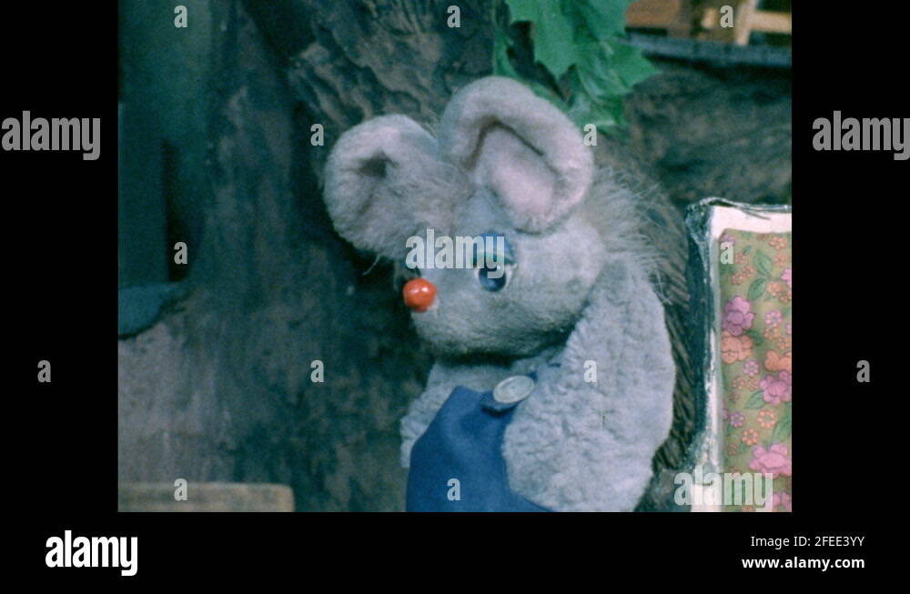 1970s: Mouse puppet leans on wall. Skunk puppet talks to mouse puppet ...