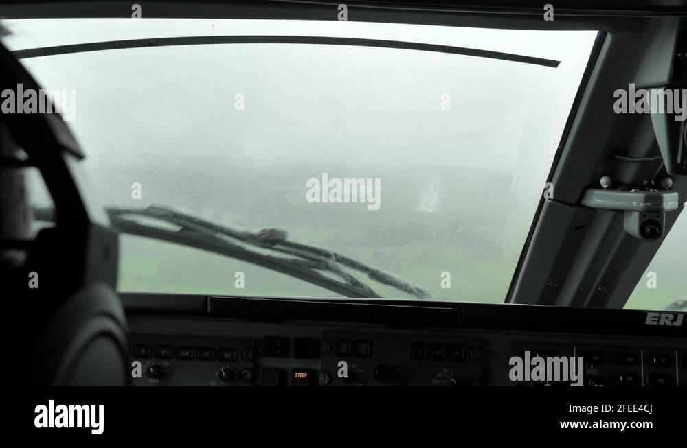Point of View Airline Pilot Landing Aircraft in Bad Rainy Weather Stock ...