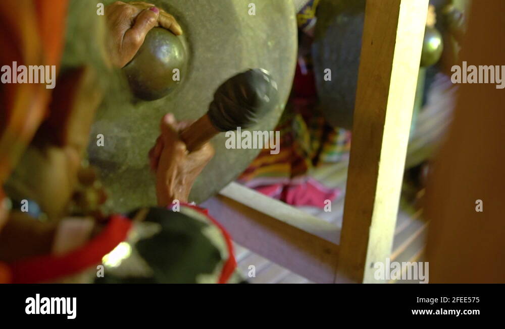 Old T'Boli Filipino Tribal Woman Playing a Native Percussion Instrument ...