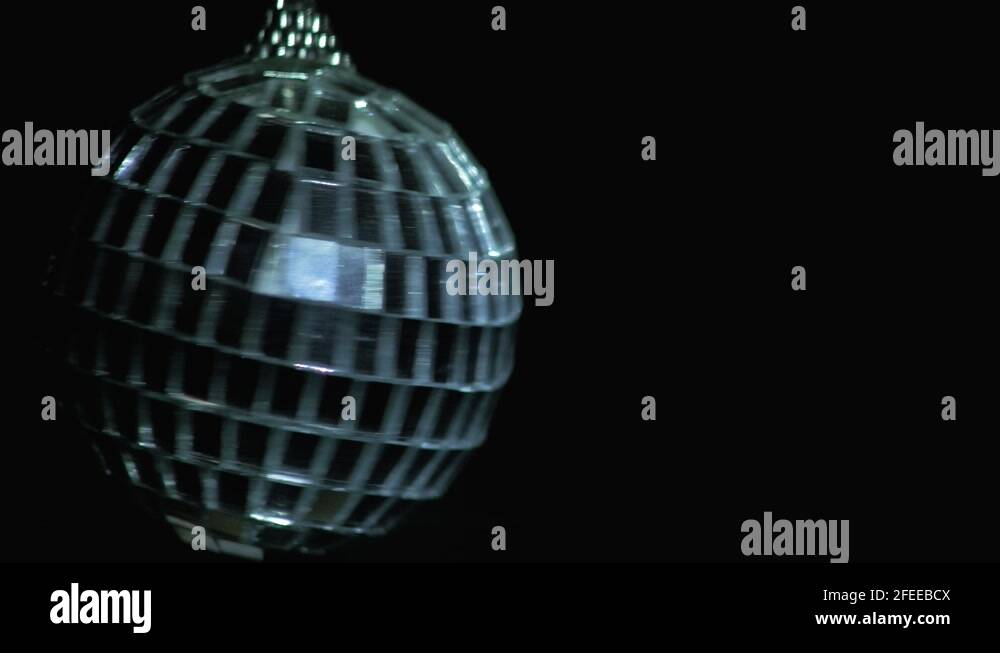 Small rotating disco ball with reflecteding rays, Anamorphic lens flare ...