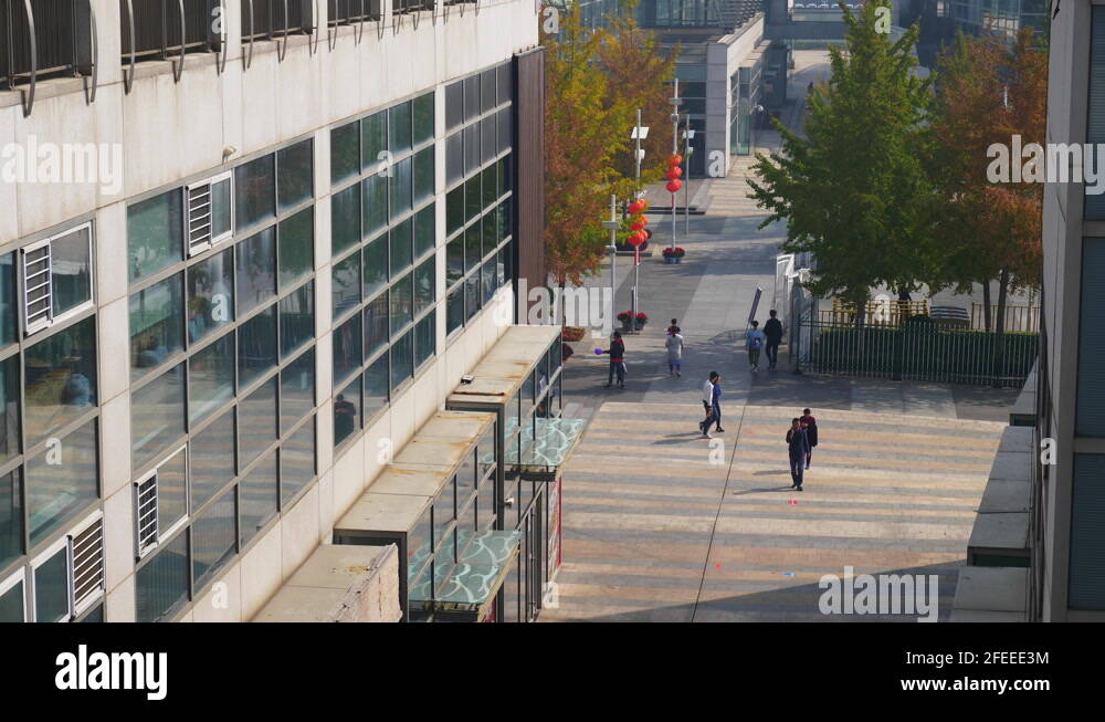 qingdao sunny coastal mall crowded stairs rooftop slow motion panorama ...