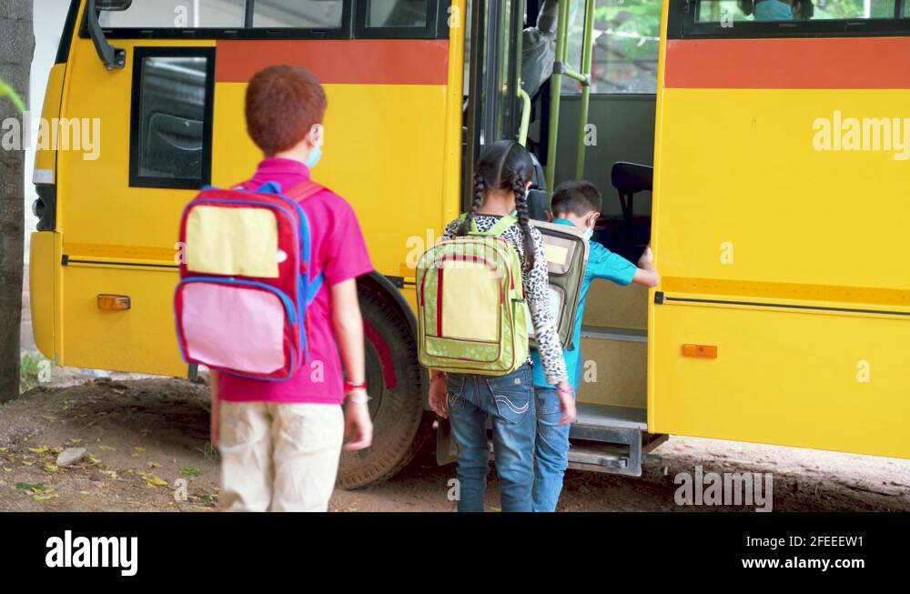 Students getting inside the bus Stock Video Footage - Alamy