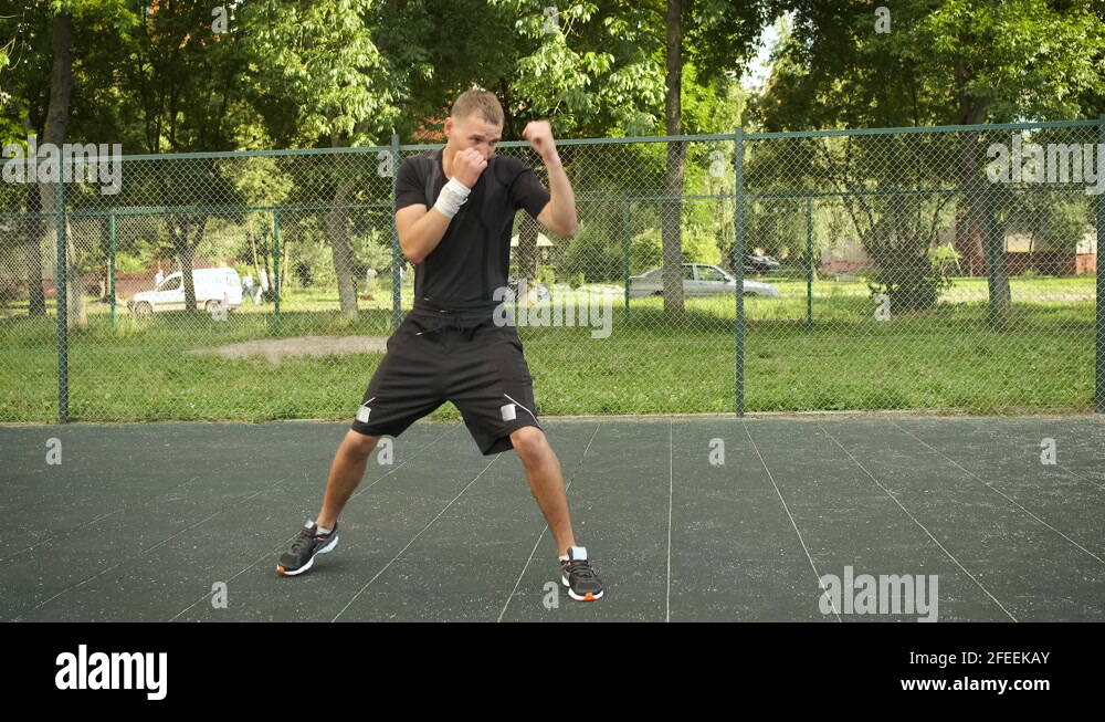Boxing. The young man trains on a sports ground. Sports and health ...