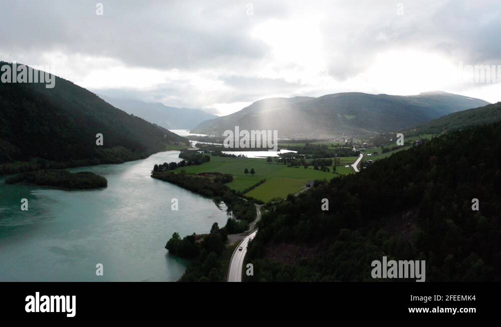 Rain falling from the clouds through light rays filmed with a drone ...