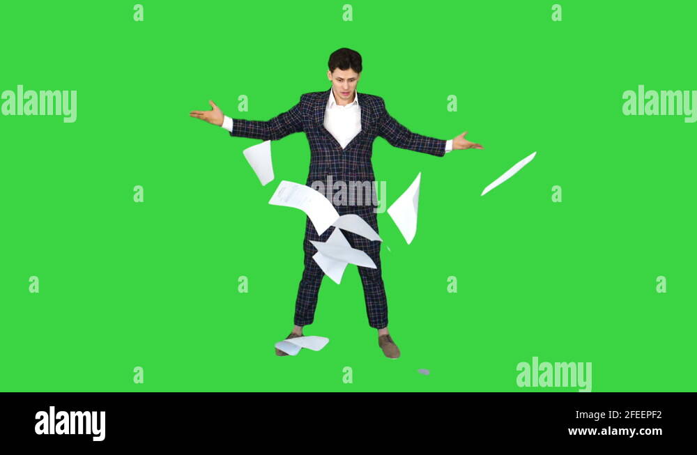 Businessman throwing papers in the air and dancing on a Green Screen ...