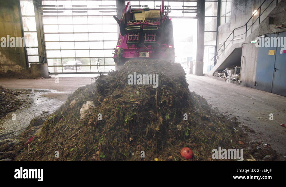 Orbit of a garbage truck after dumping a garbage heap into a compost ...