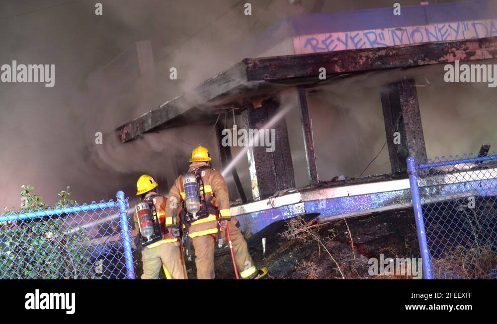 Fireman putting out building fire Stock Videos & Footage - HD and 4K ...