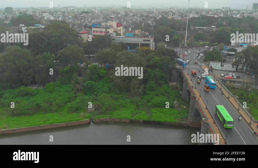 falling drone shot looking down traffic on Chhatrapati shivaji road ...