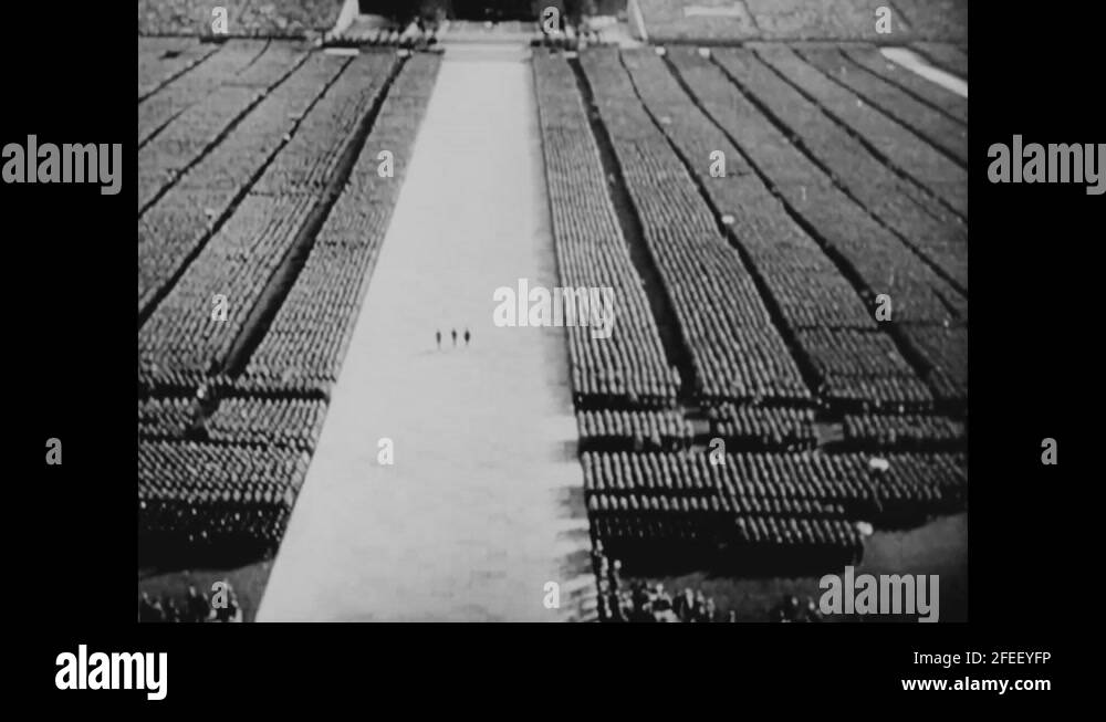 Adolf Hitler walking through formations of troops during Nuremberg ...