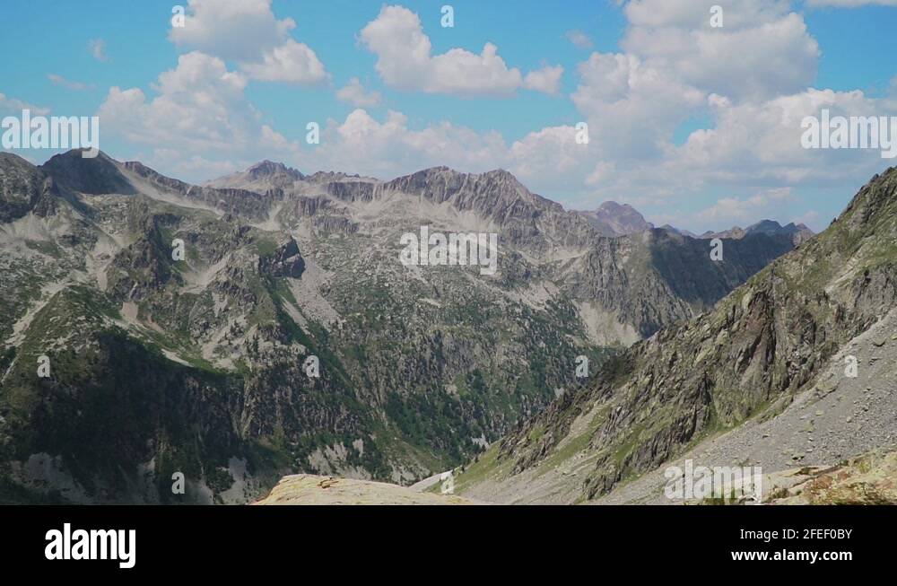 Pan wide shot for the top of the mountains of the Alps in Italy with ...