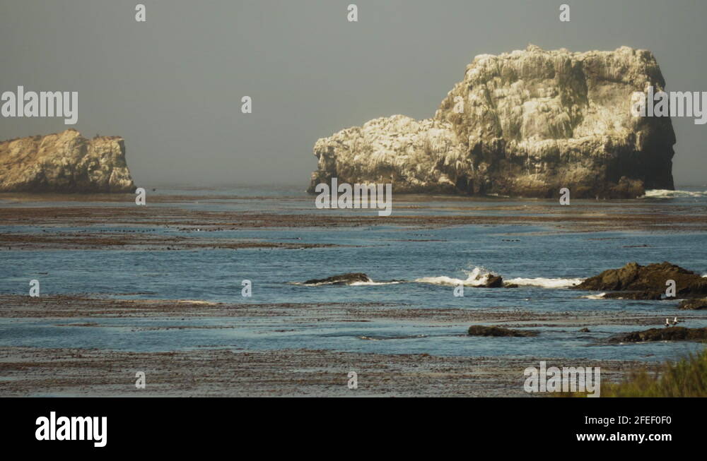 Static view of the large rock island formations offshore from an ...
