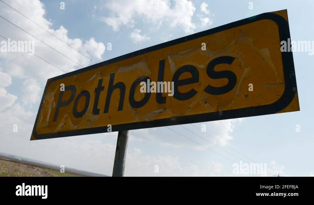 Pot hole warning sign Stock Videos & Footage - HD and 4K Video Clips ...