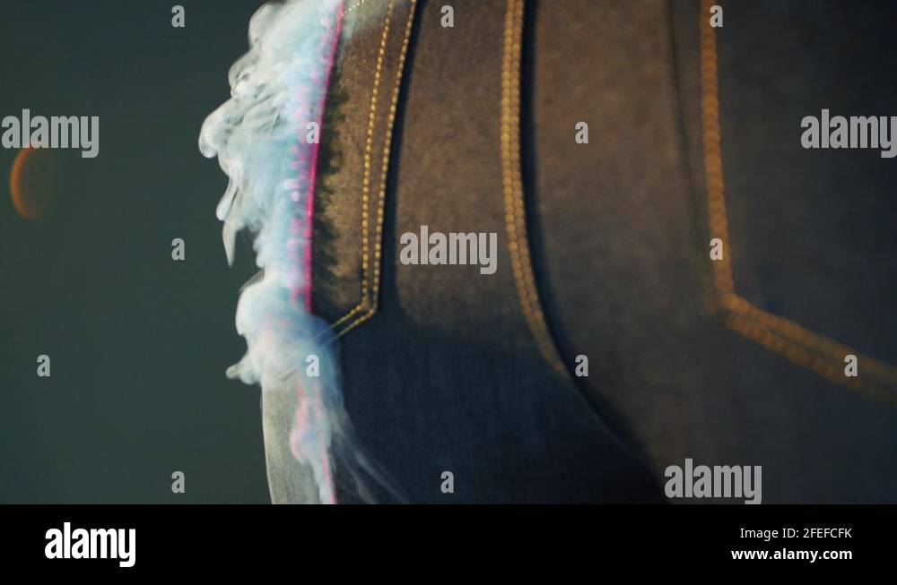 denim factory using laser beams to make design on blue jeans. slow ...