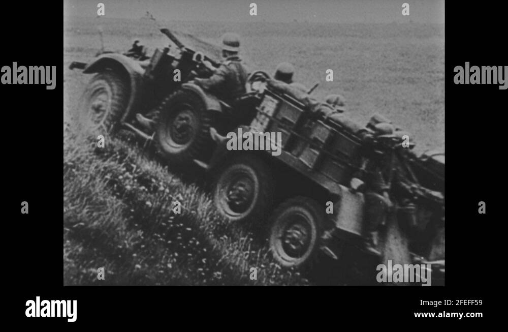 1940s: Wheels of tank. Military jeep with soldiers. Tanks drive across ...