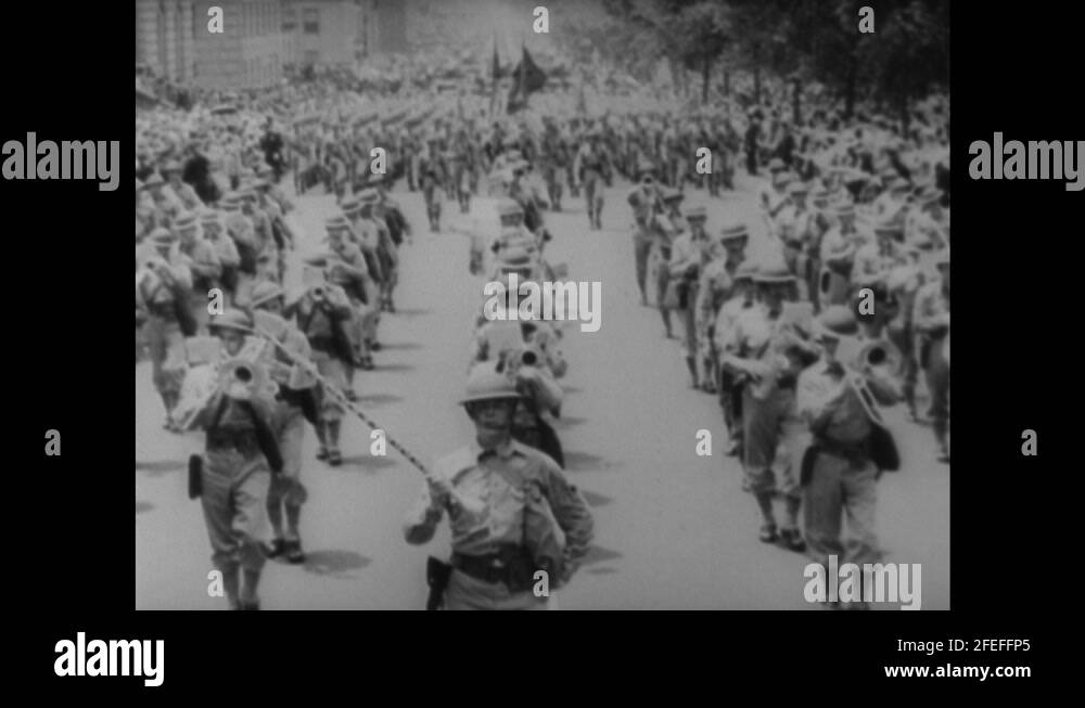 1940s: Soldiers in marching band in parade. Soldiers carrying flags in ...