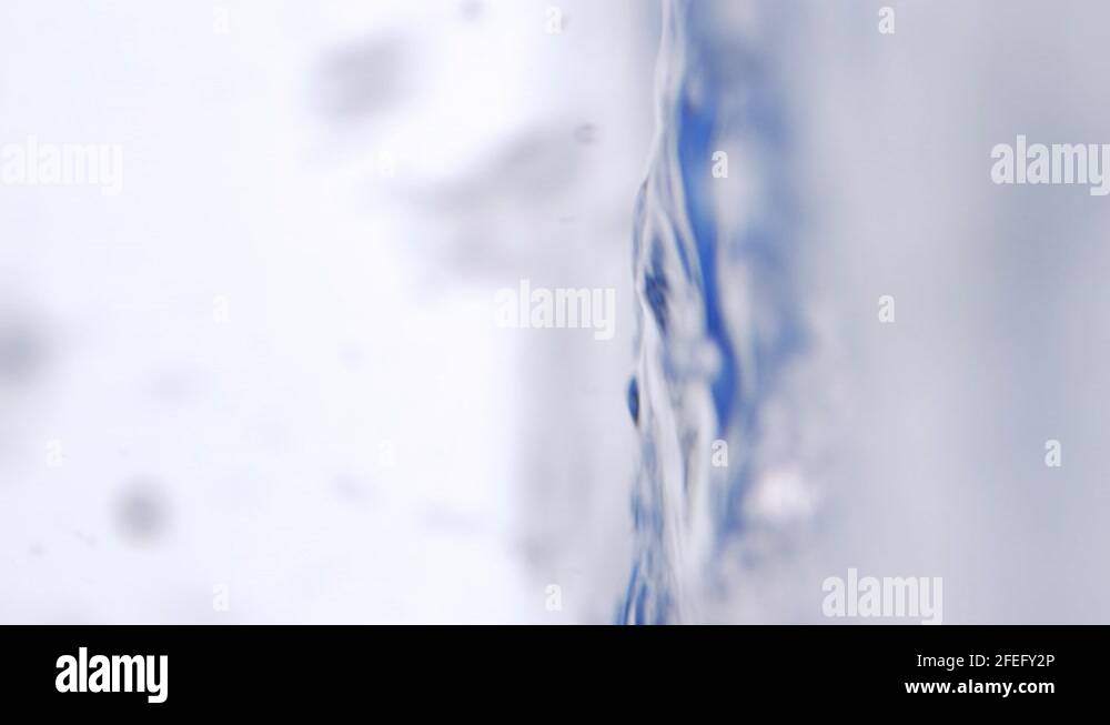 Vertical video footage of water splash surface filling the frame with ...