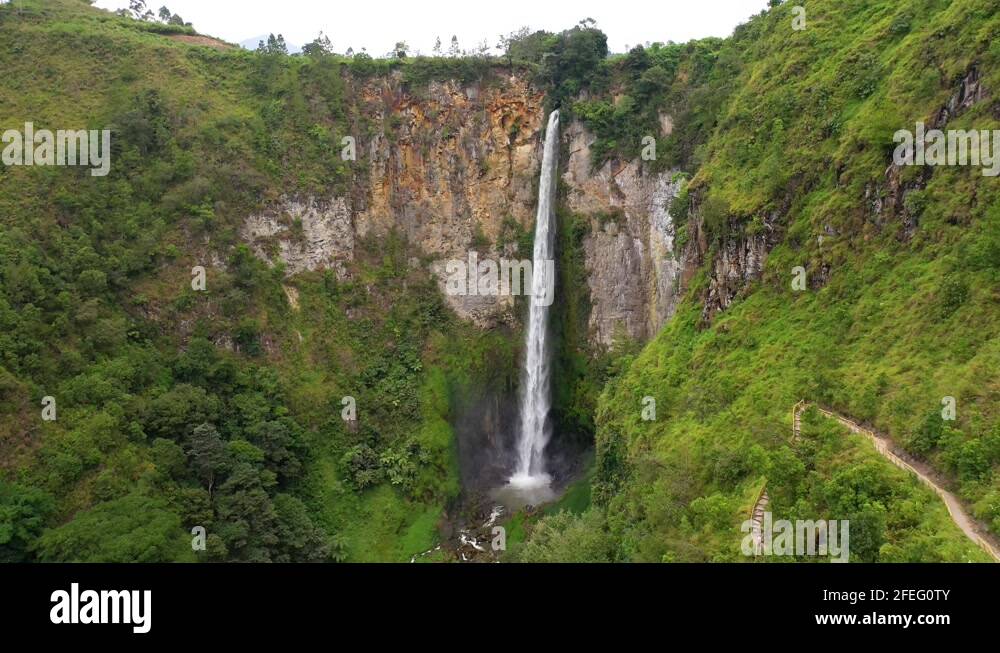 Cinematic aerial view of the majestic Sipiso Piso Waterfall in North ...