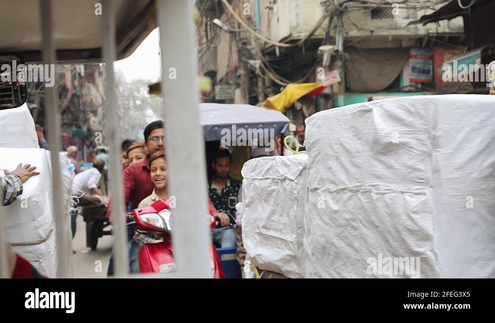 An electric auto rickshaw ride through the heavily crowded and narrow ...
