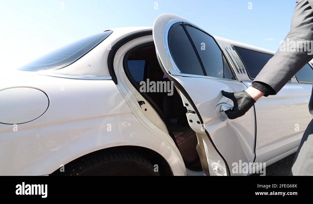 Your ride sir. A limo door is opened in slow motion. limousine driver ...