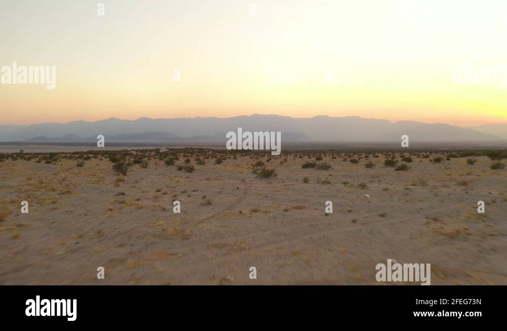 Low drone shot, wide view from the desert at mexicali valley, entering ...