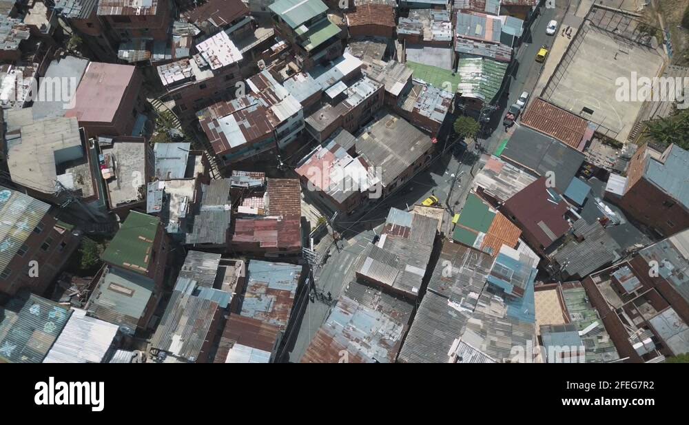 Drone aerial, flying low, bird's-eye view of ghetto slums in a poor ...