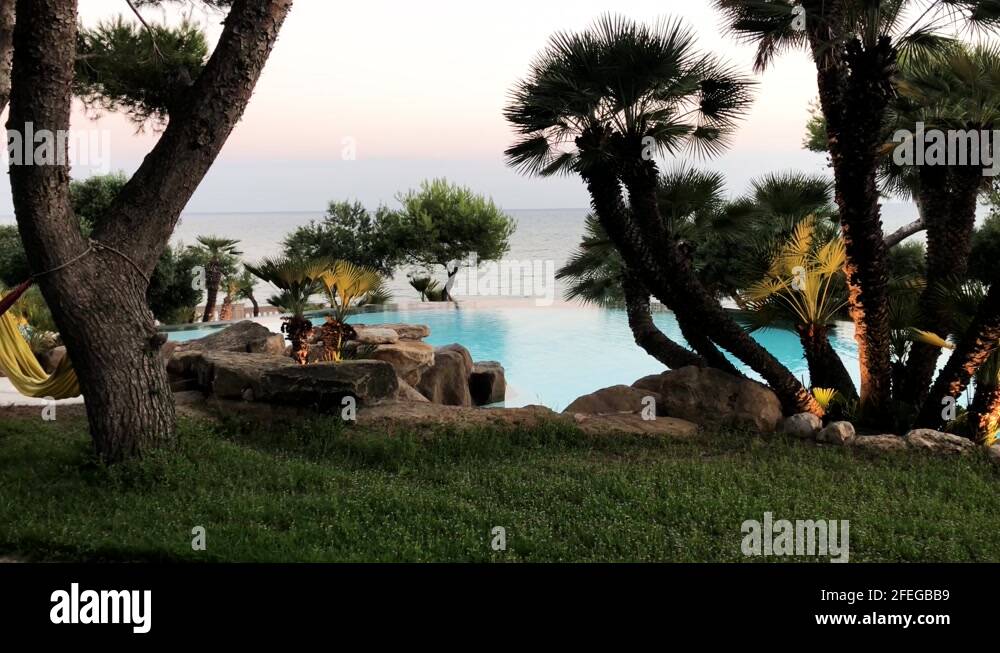 Static view of an amazing garden in Spain. View of an infinity pool in ...