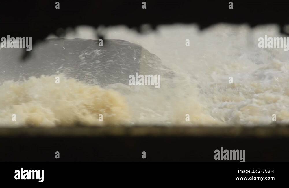 A heavy flow of water dropping off of waterfalls of Usri River after ...