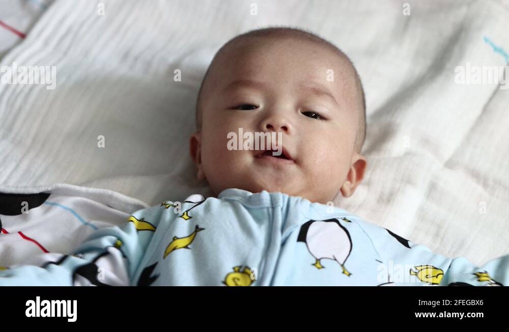 Local Lifestyle Asian Chinese happy active baby boy keep moving hand ...