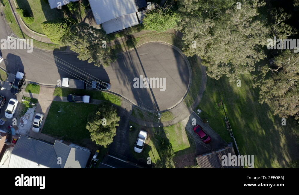 Rotating birds-eye view of a culdesac in a western suburb in Sydney ...