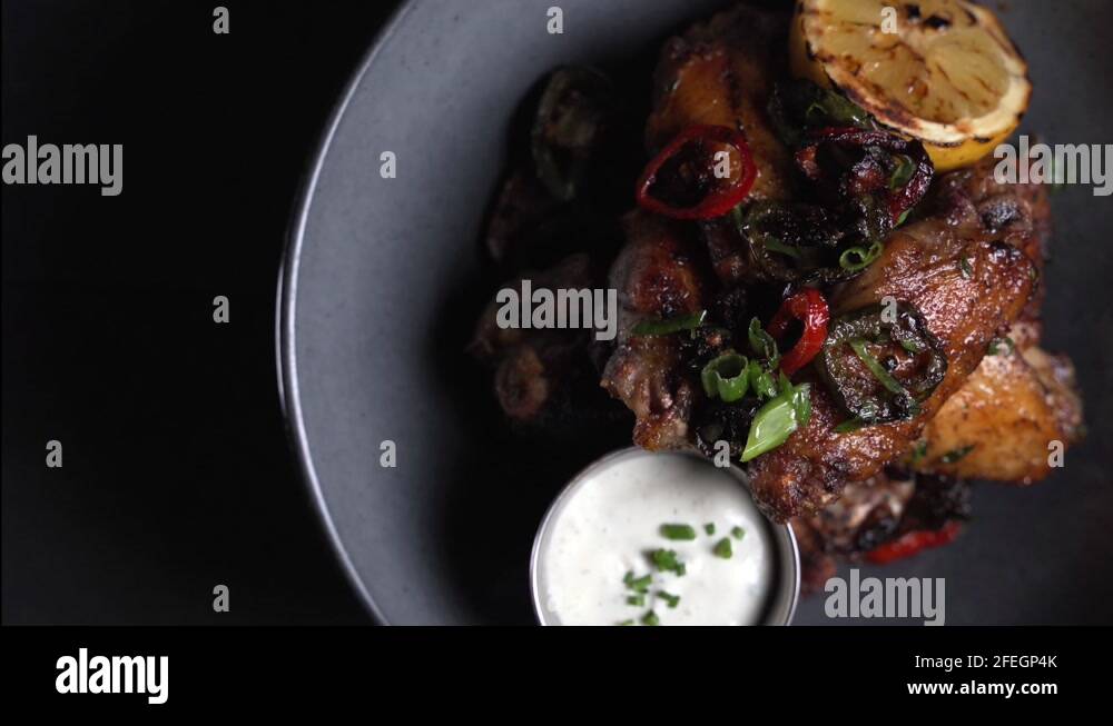 Chicken Wings with Ranch spinning black background 4k Stock Video ...