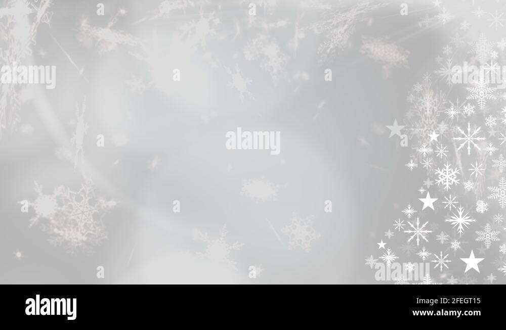 Snowflakes falling against white background Stock Video Footage - Alamy