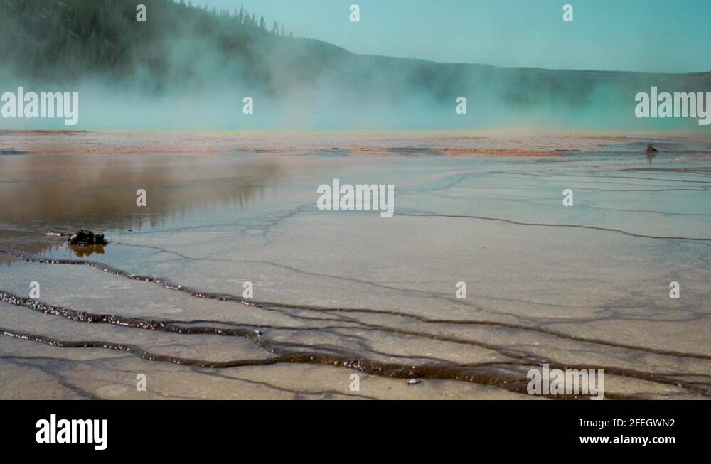 Steam coming off the boiling super heated waters of the Grand Prismatic ...