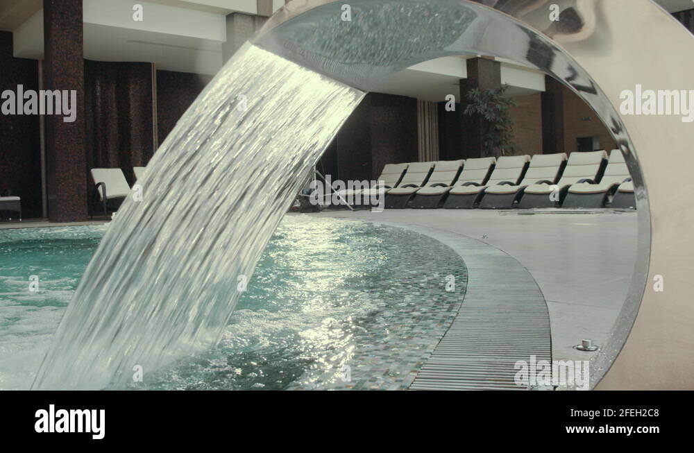 Waterfall jacuzzi in hotel spa. Water stop flowing hydromassage ...