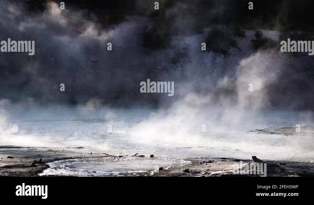 Steam rises from a thermal pool in yellowstone national park Stock ...