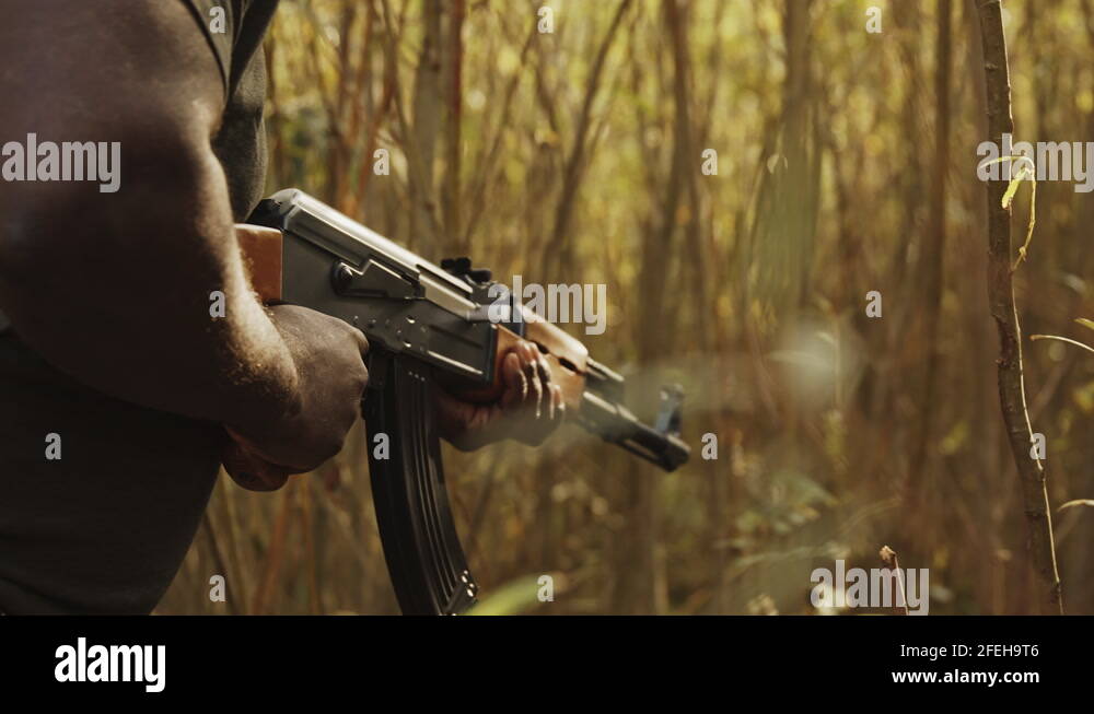 Machine gun man walking Stock Videos & Footage - HD and 4K Video Clips ...