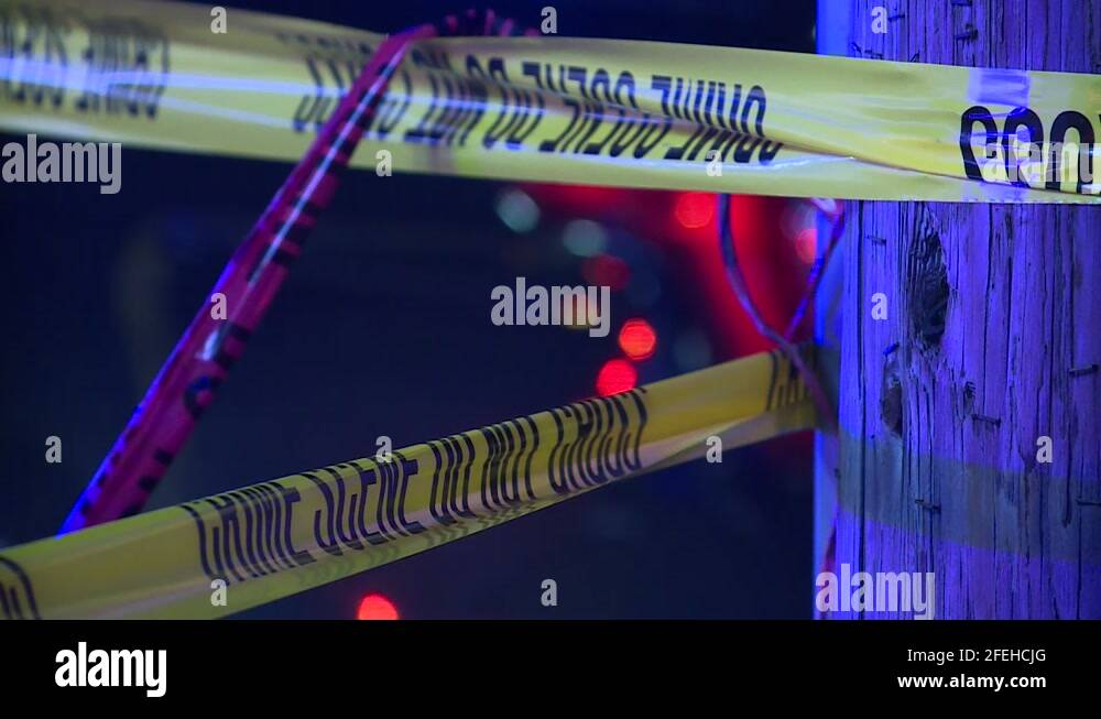 POLICE TAPE AROUND CRIME SCENE AT NIGHT Stock Video Footage - Alamy