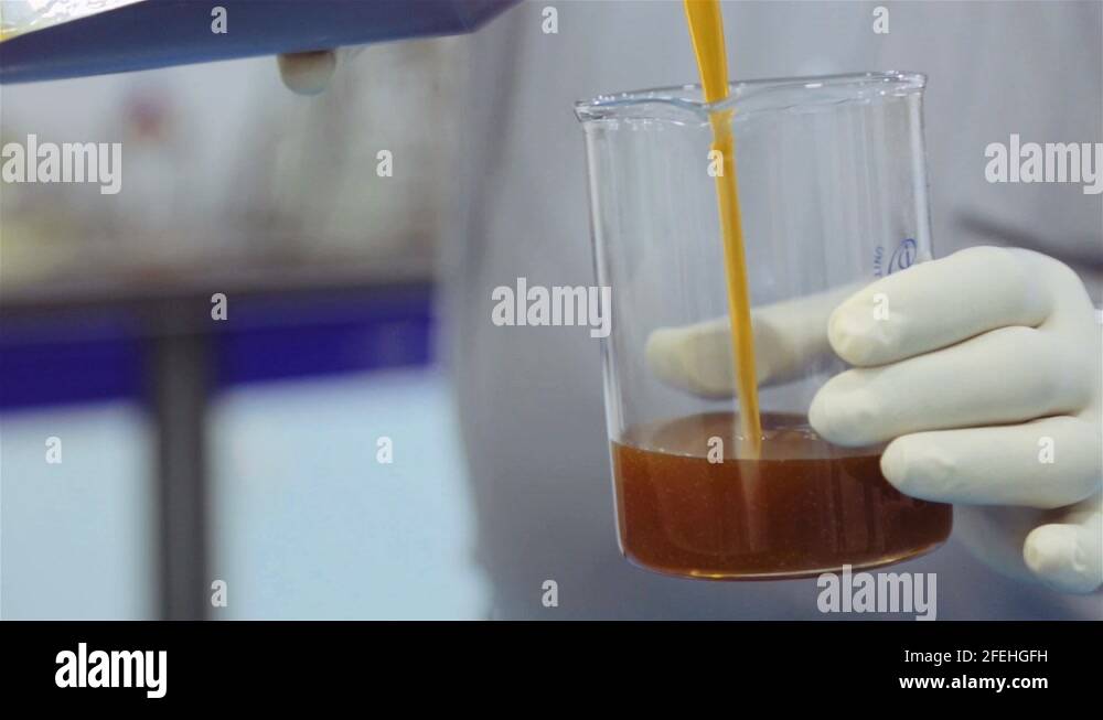 Scientist pouring liquid into beaker Stock Videos & Footage - HD and 4K ...